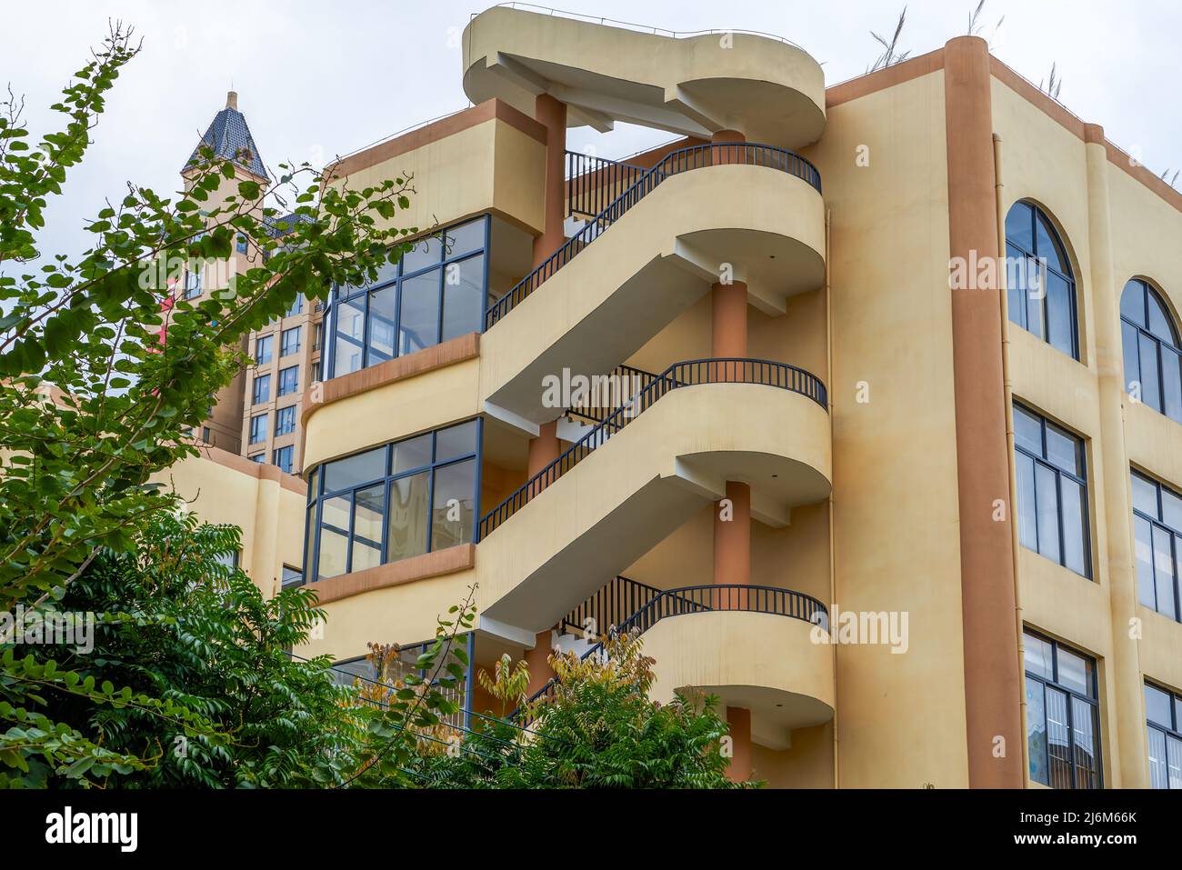 Close-up of a spiral staircase at the periphery of a high-rise building ...