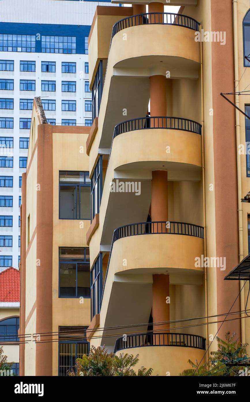 Close-up of a spiral staircase at the periphery of a high-rise building ...