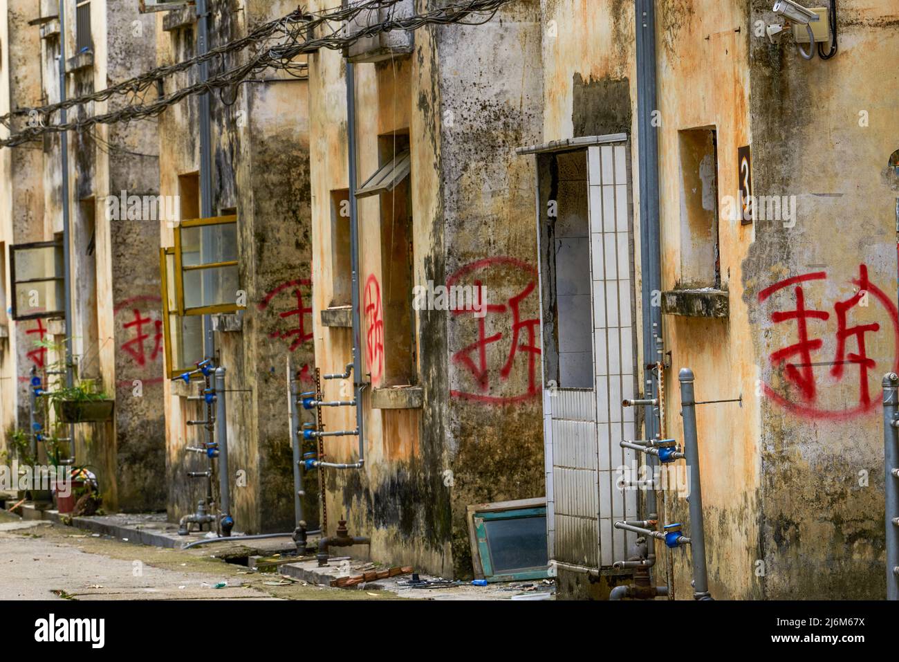 Demolition words are written on the abandoned old residential buildings ...