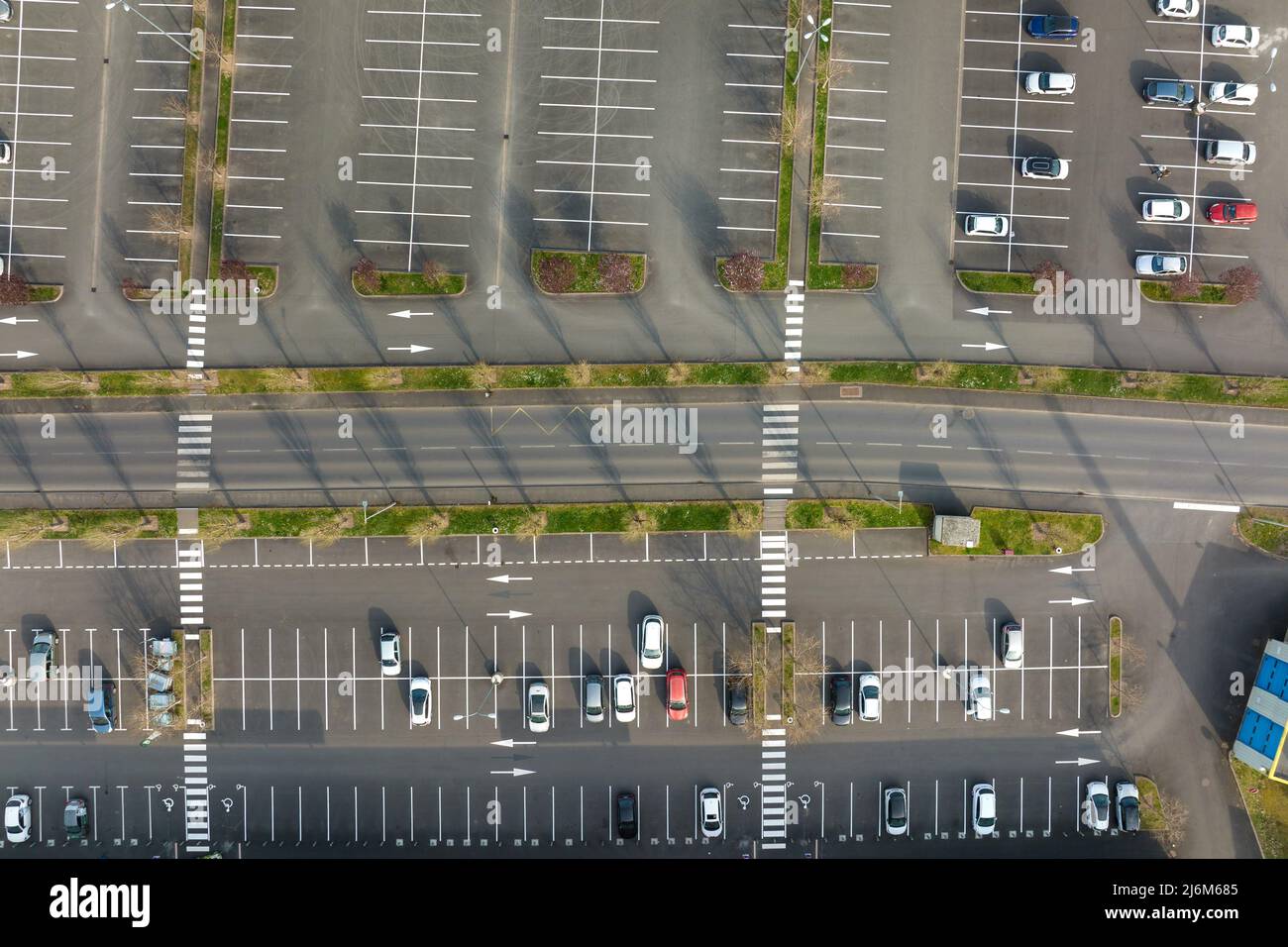 Aerial view of many colorful cars parked on parking lot with lines and ...