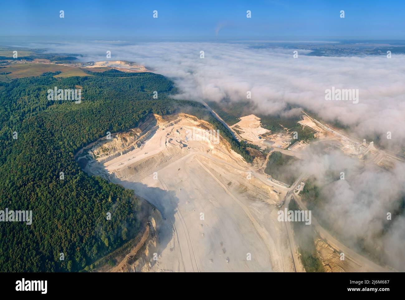 Aerial view of open pit mining of limestone materials for construction ...