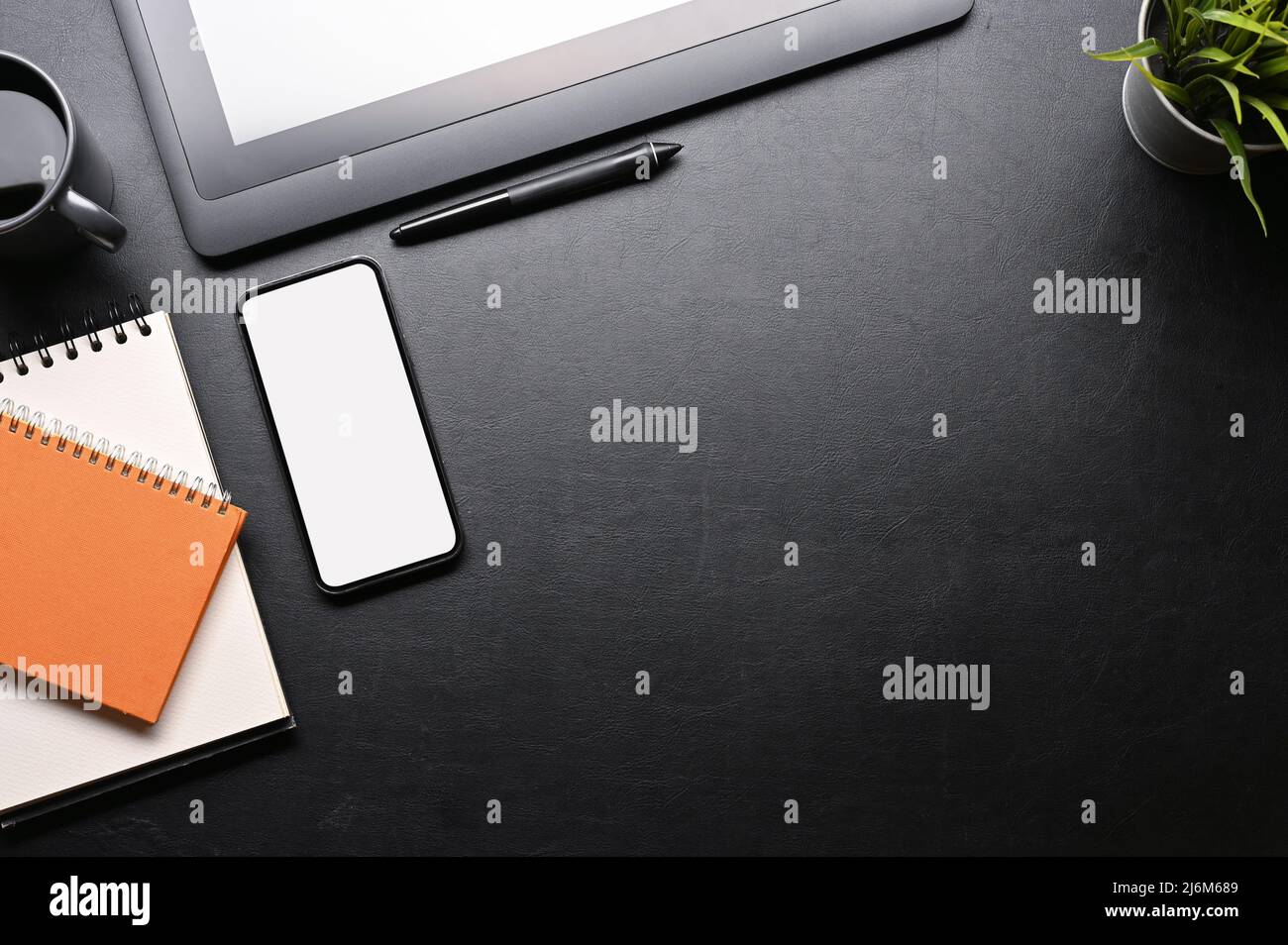 Dark stylish graphic designer workspace with graphic tablet, pen ...