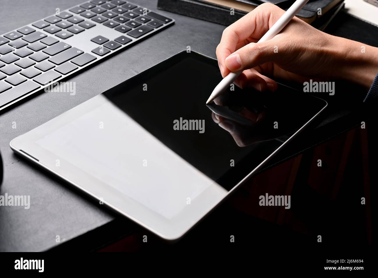 Close-up image, Male graphic designer using stylus pen designing his ...
