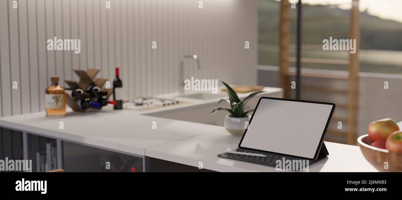 Portable tablet touchpad white screen mockup on a modern white kitchen ...