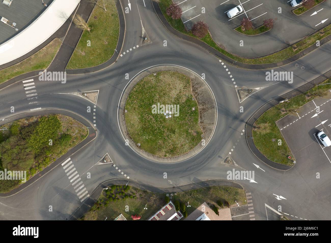 Aerial view of road roundabout intersection with fast moving heavy ...