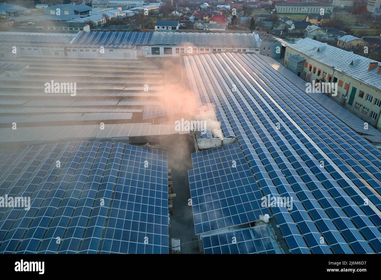 Aerial view of solar power plant with blue photovoltaic panels mounted ...