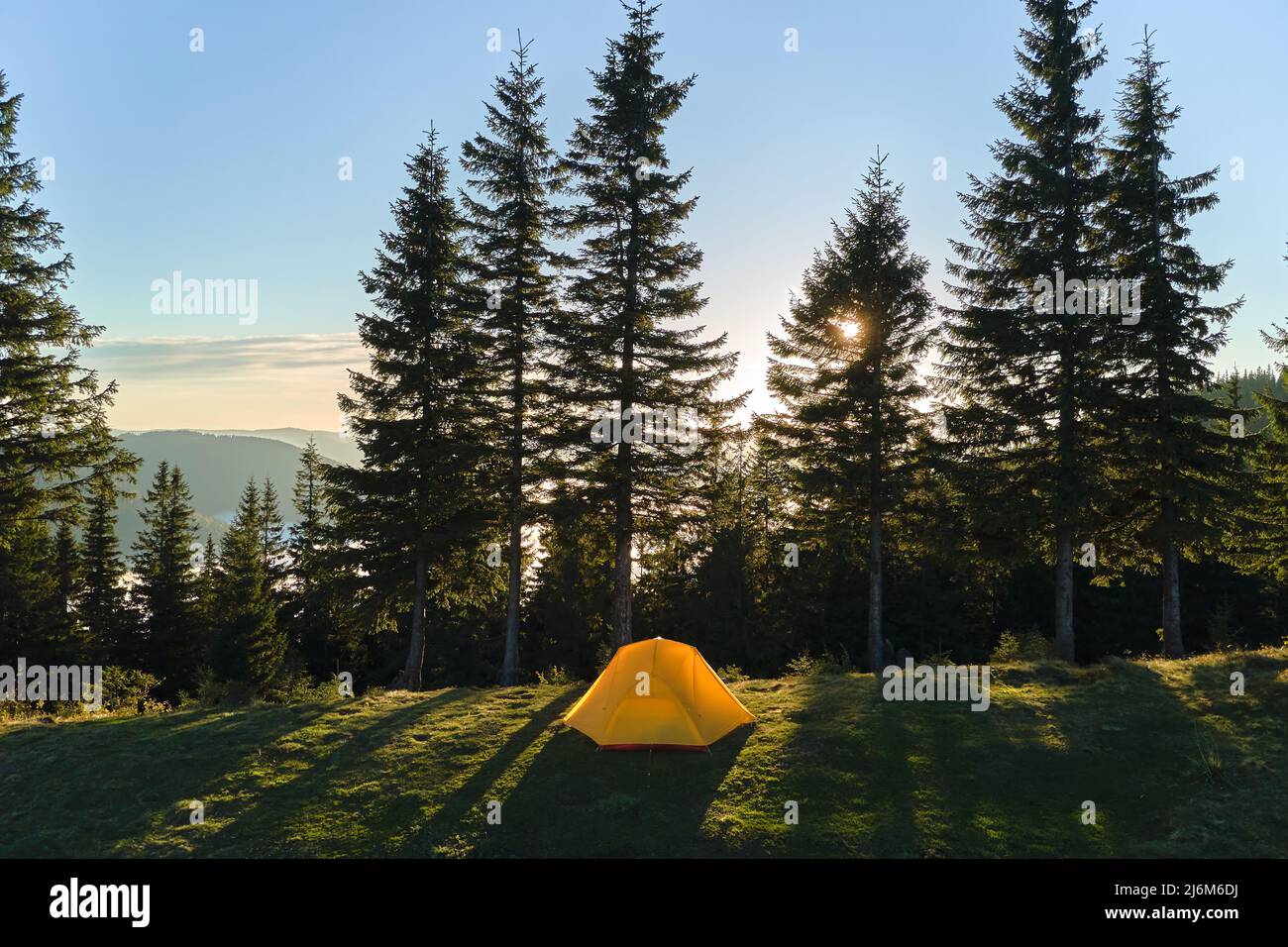 Aerial view of tourist camping tent on mountain campsite at bright ...