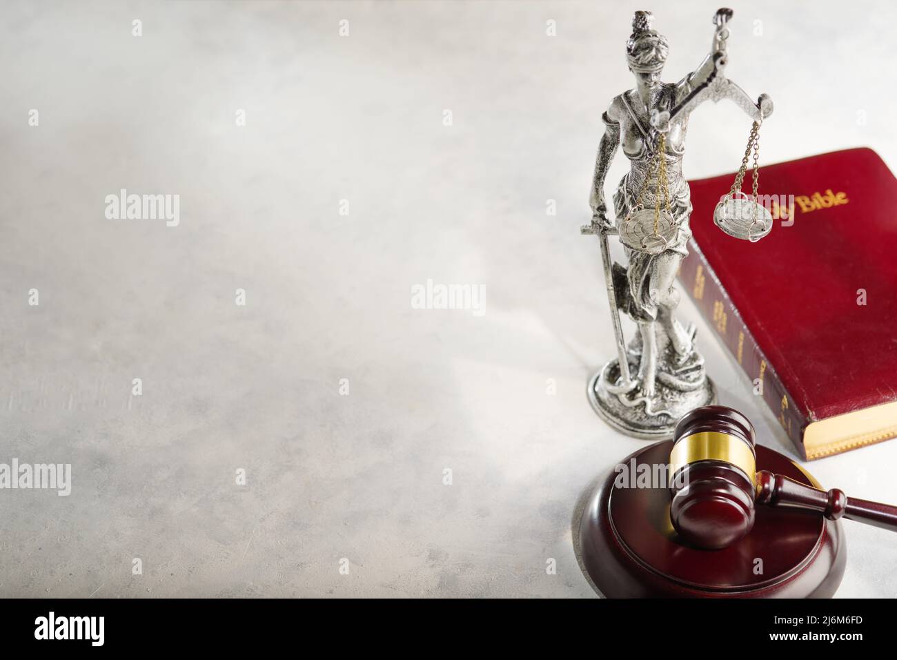 Holy bible, judge's gavel and figurine of Themis on a white background ...