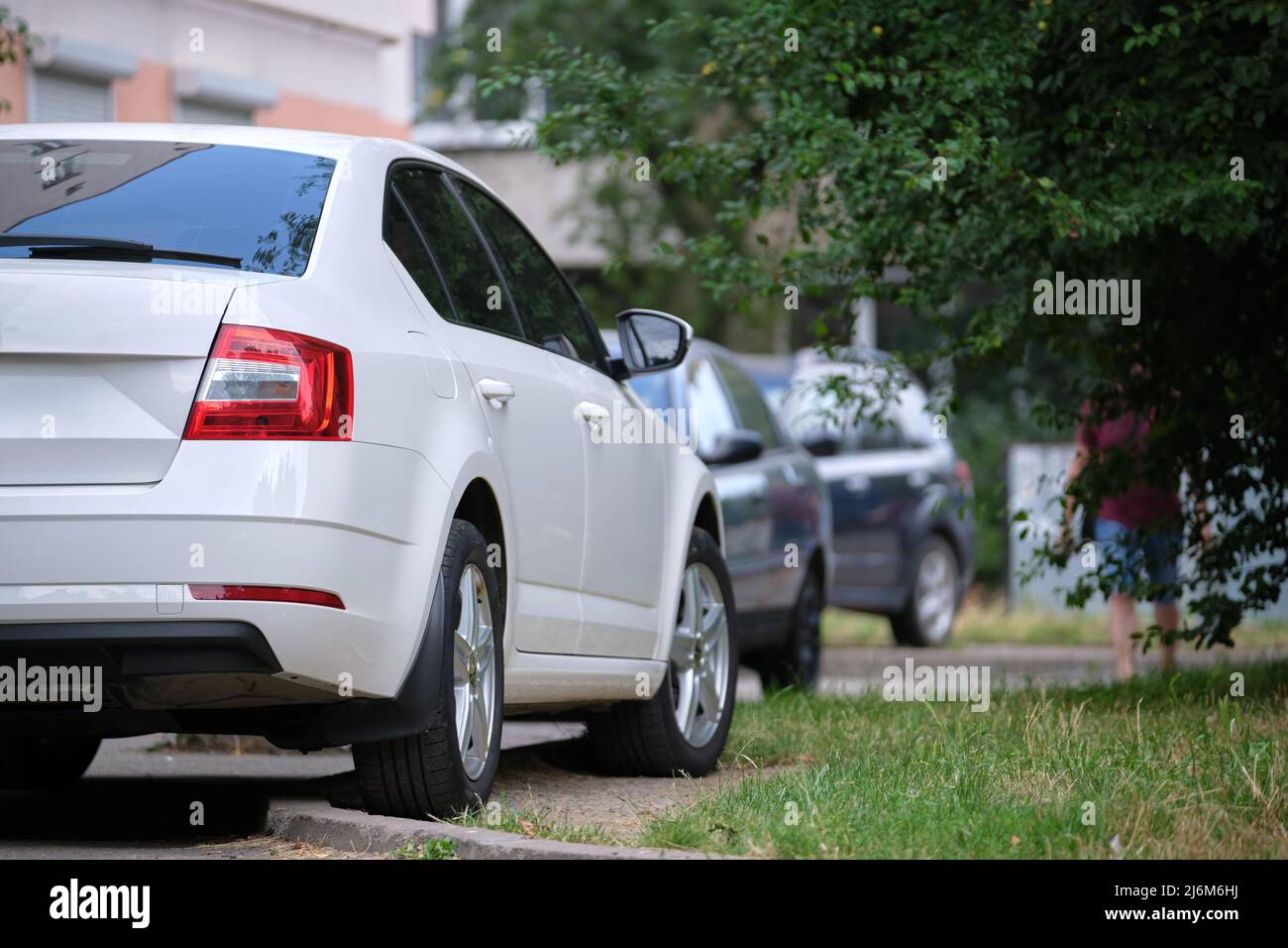 Cars parked in line on city street side. Urban traffic concept Stock ...