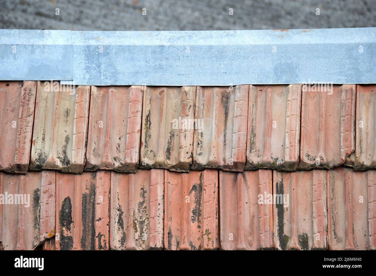 Closeup surface of old weathered ceramic tiles covering building roof ...