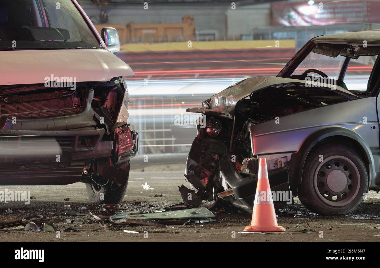 Damaged in heavy car accident vehicles after collision on city street ...