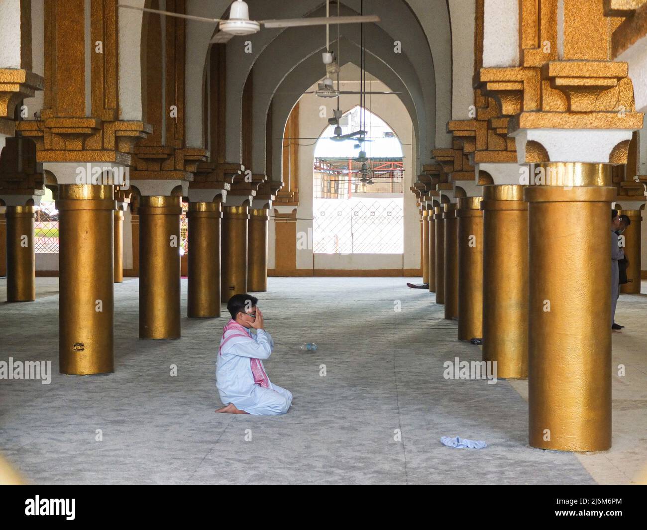 A young Muslim boy seen praying inside the Golden Mosque in Quiapo. The ...