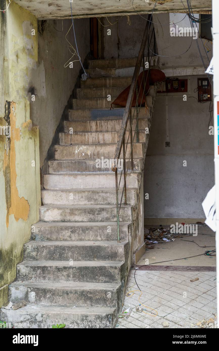 Close-up of residential building stairs in an abandoned old residential ...