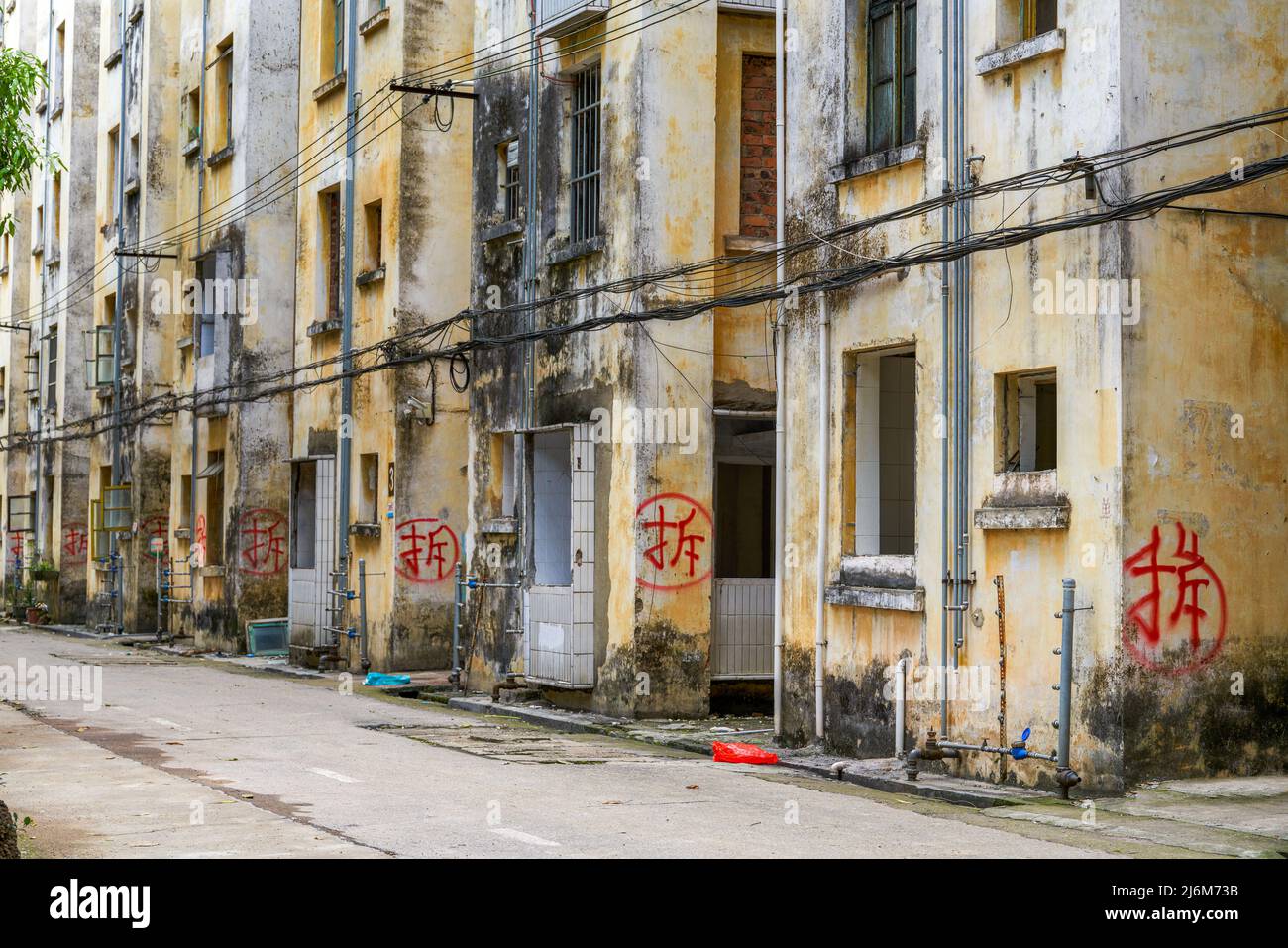 Demolition words are written on the abandoned old residential buildings ...