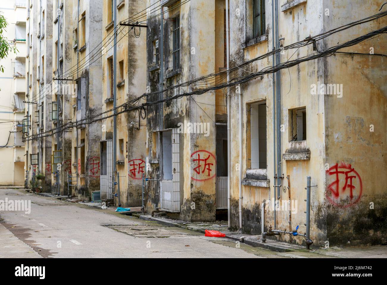 Demolition words are written on the abandoned old residential buildings ...