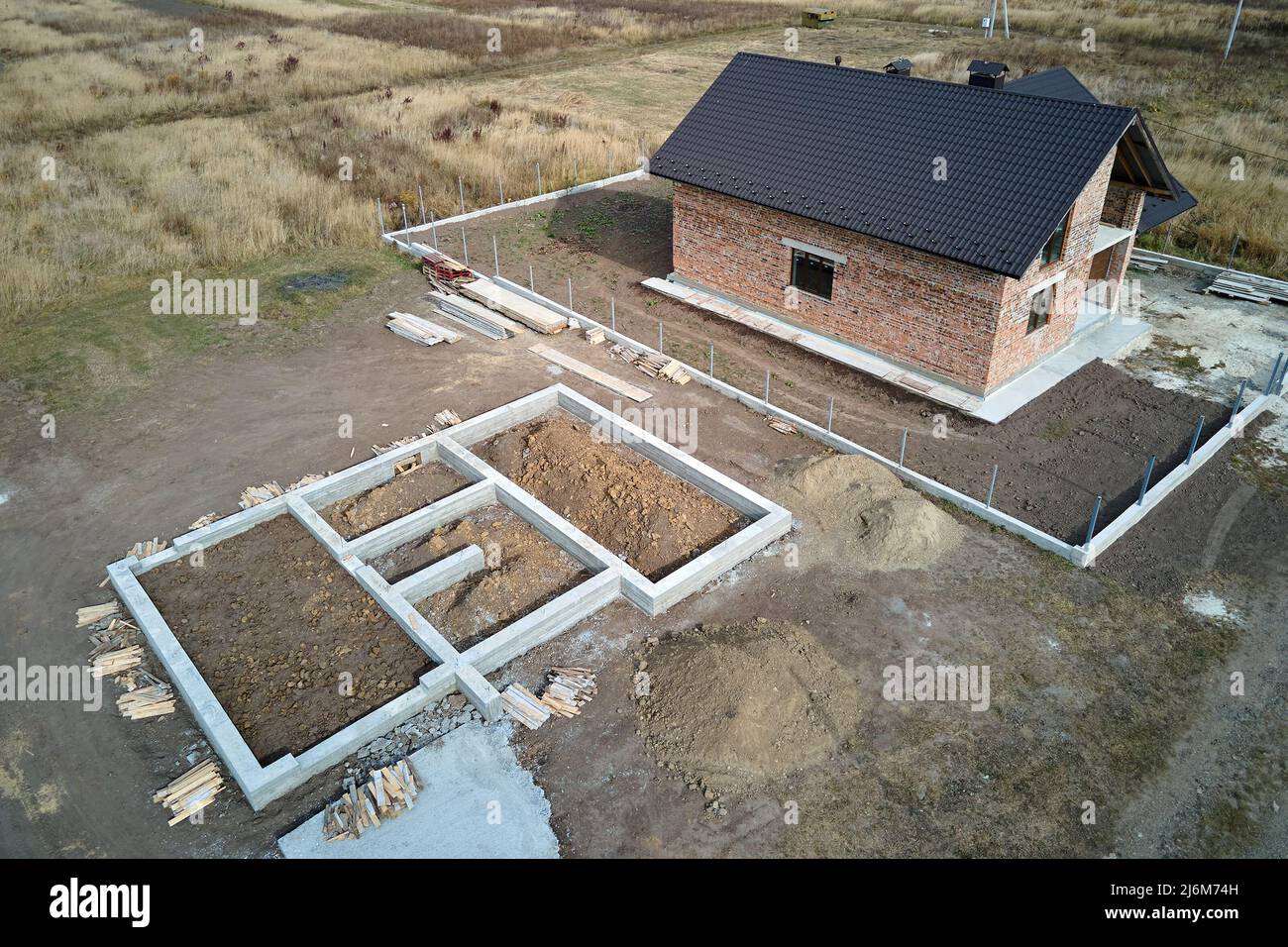 Top down aerial view of building works of new house concrete foundation ...
