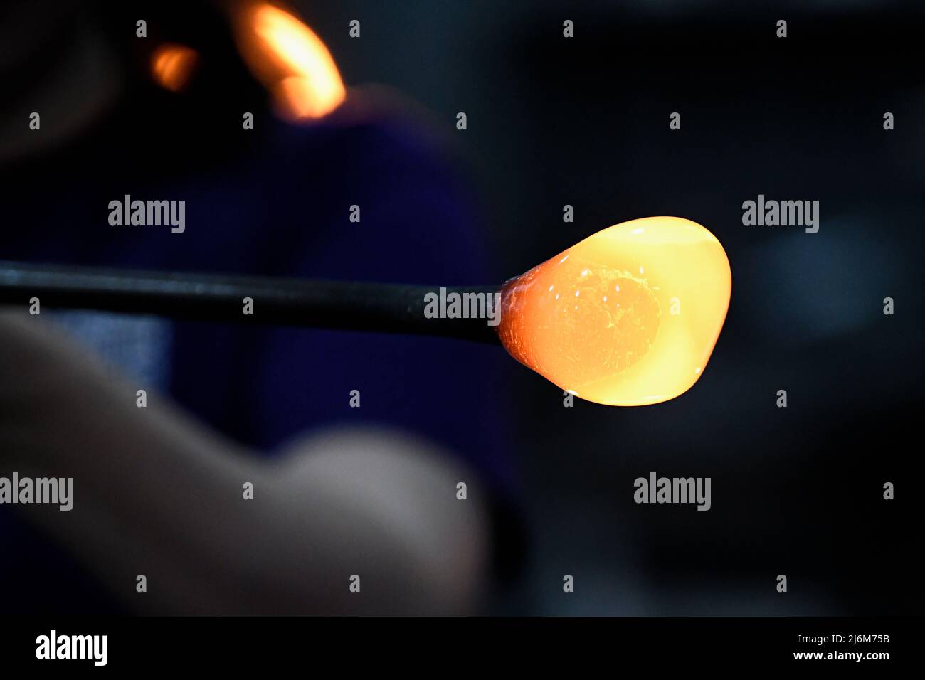 Molten glass being worked into an ornament at melting point Glass ...