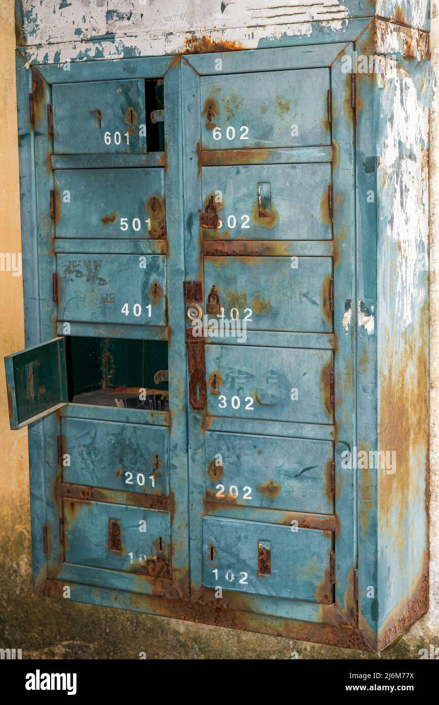 Old green metal mailbox cabinet Stock Photo - Alamy