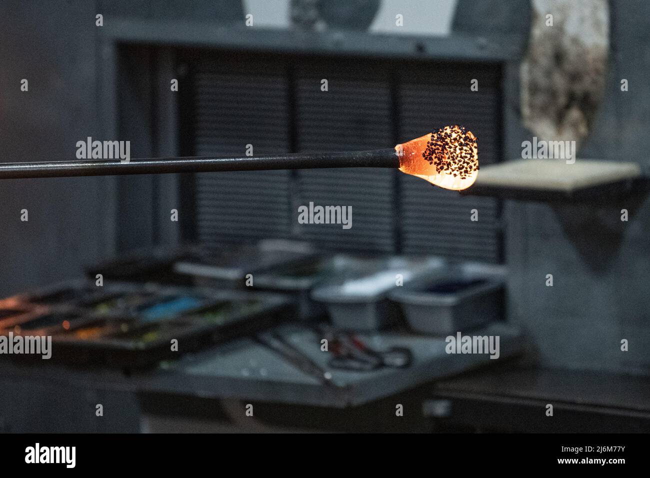 Molten glass being worked into an ornament at melting point Glass ...