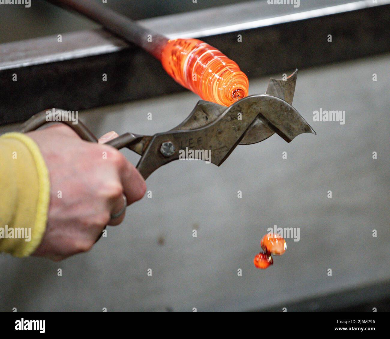 Molten glass being worked into an ornament at melting point Glass ...
