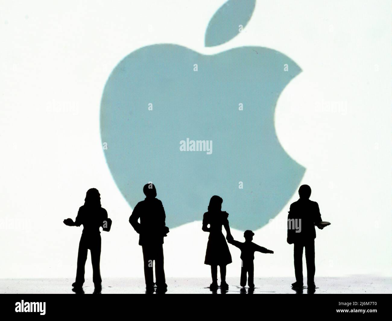 In this photo illustration, Miniature figures stand in front of an ...