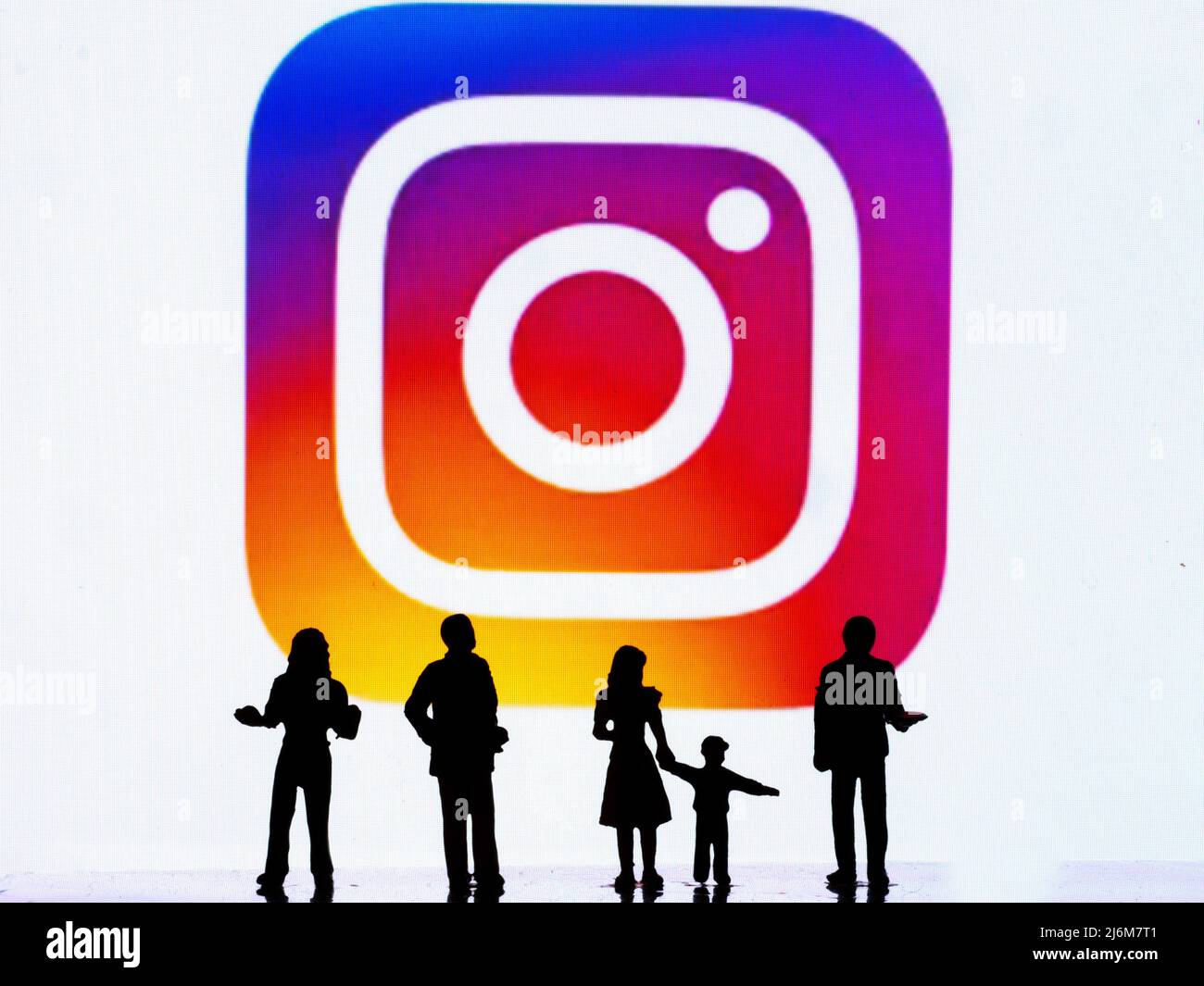 In this photo illustration, Miniature figures stand in front of an ...