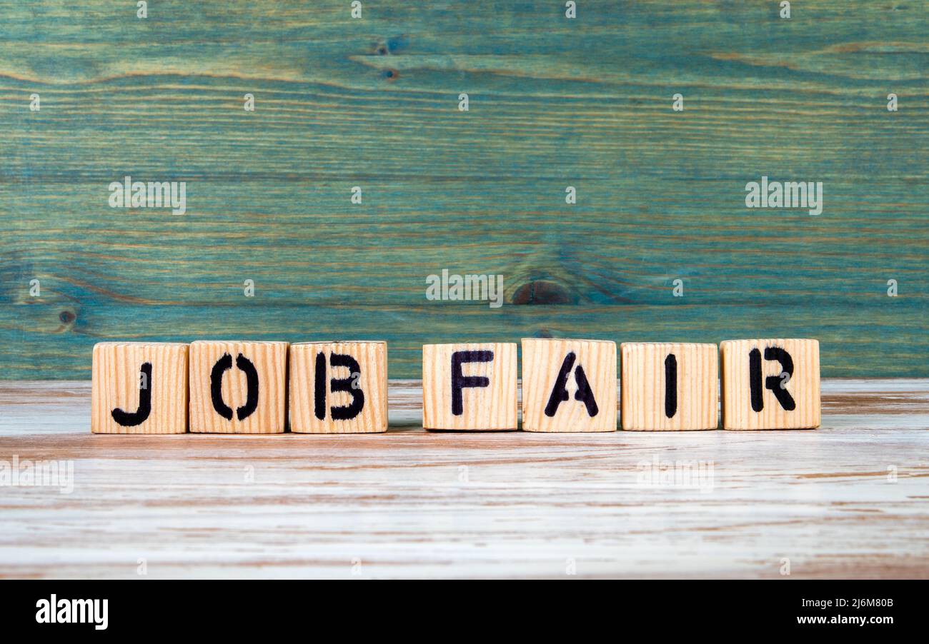 Job Fair. Text from alphabet blocks on a green and white wooden ...