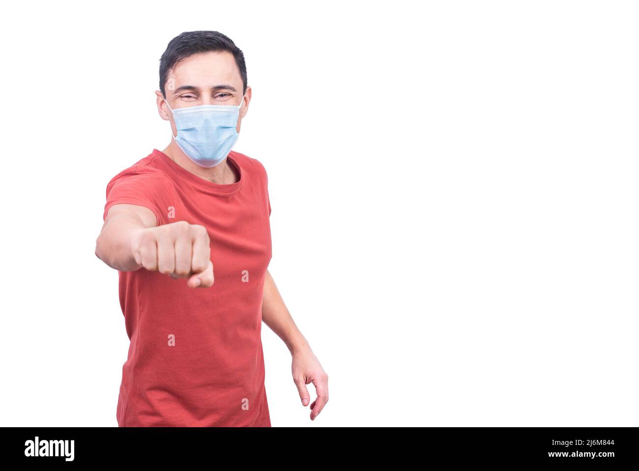 Man in medical mask doing fist bump Stock Photo - Alamy