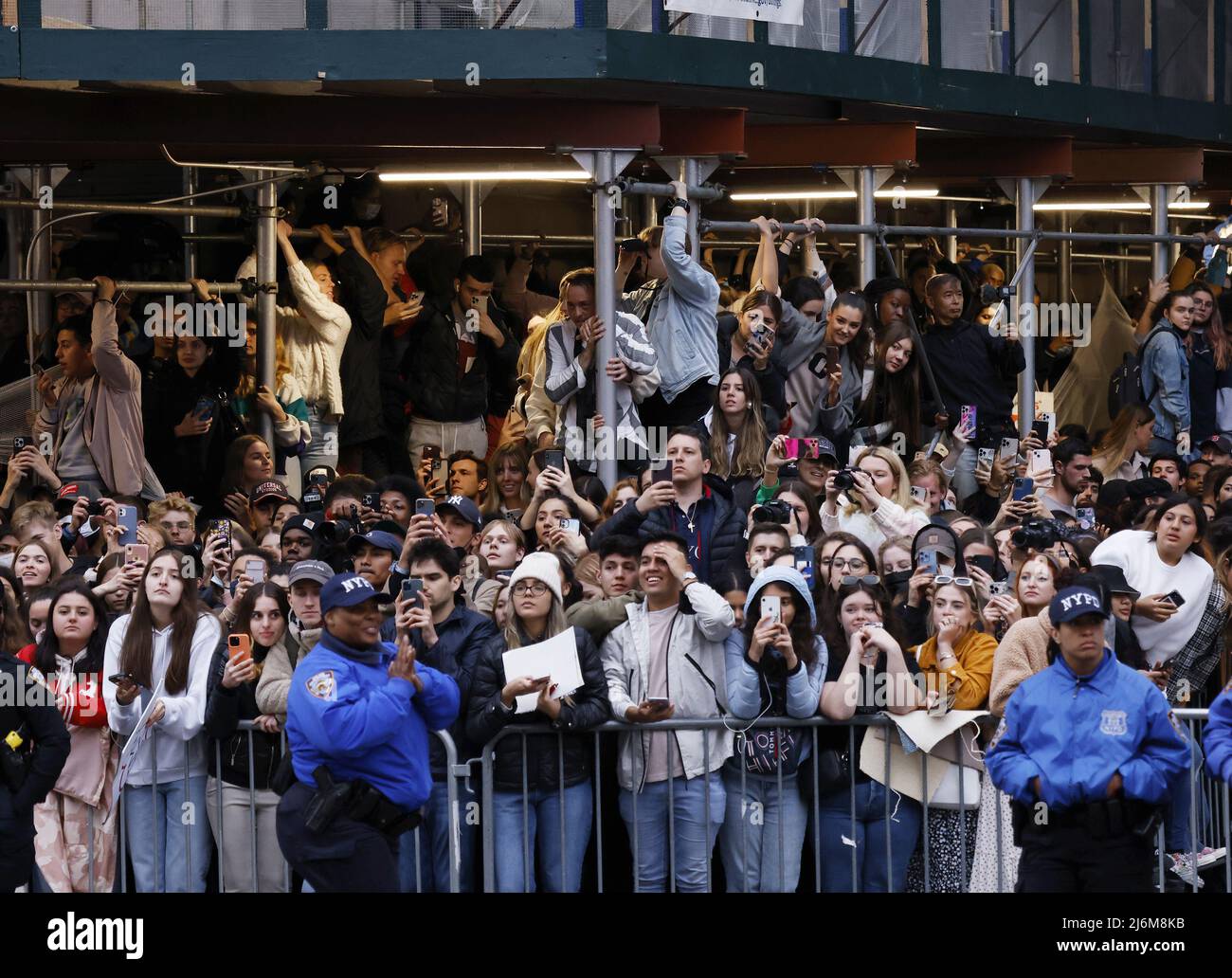 Crowds gather on the sidewalks to watch celebrities arrive on the red ...