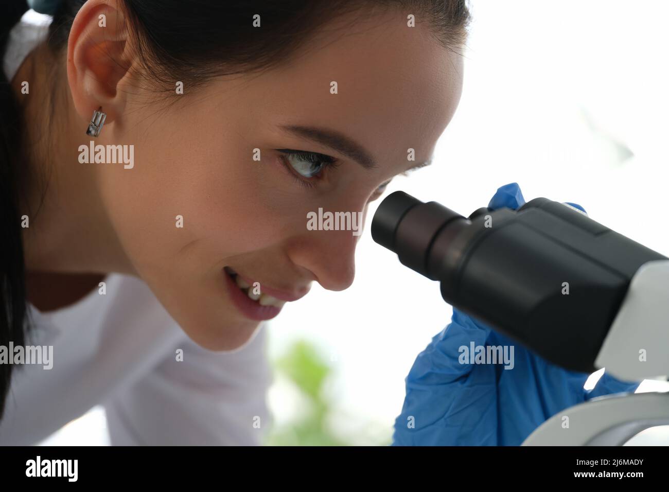 Pharmacy scientist working with professional microscope in technology ...
