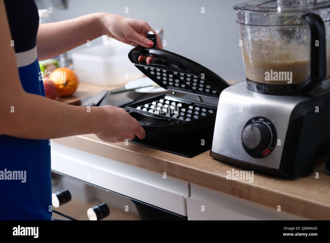 Woman hands prepare waffle hi-res stock photography and images - Alamy