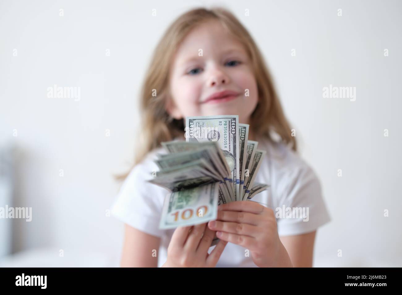 Little smiling girl counting money, happy childhood Stock Photo - Alamy
