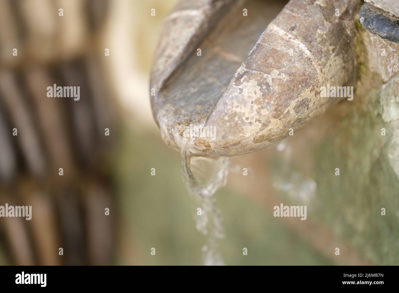 Water source in mountain, spring water or well-water Stock Photo - Alamy