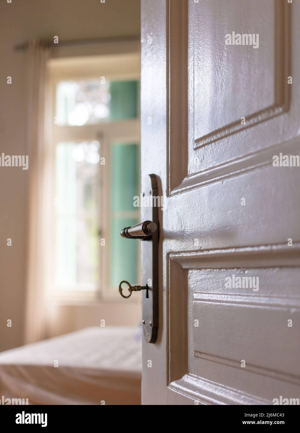 Door open, blur elegant hotel room or house bedroom interior, window ...