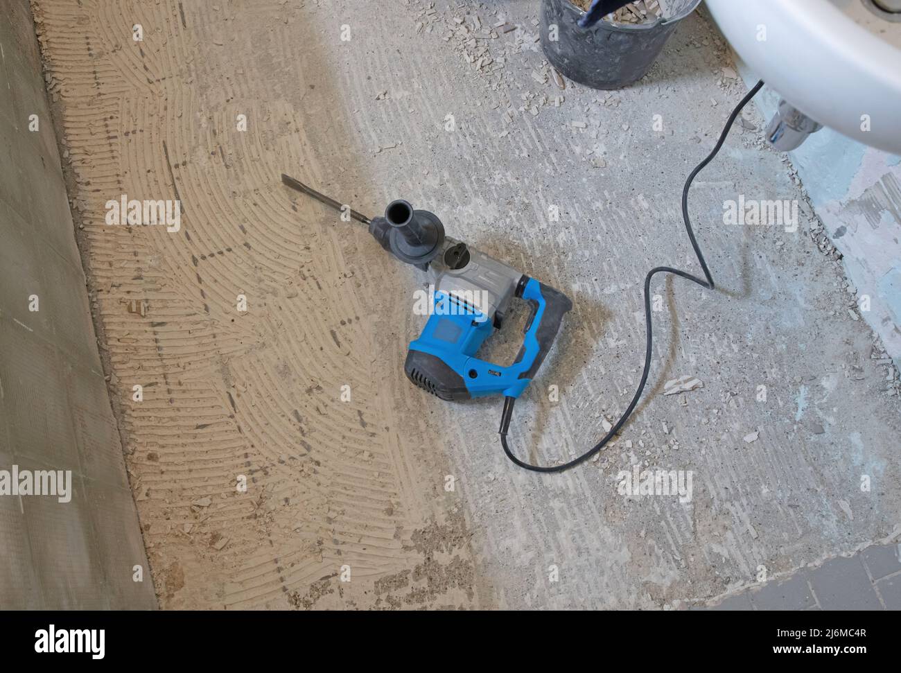 Breaking ceramic tiles, work in progress, maintenance Stock Photo - Alamy