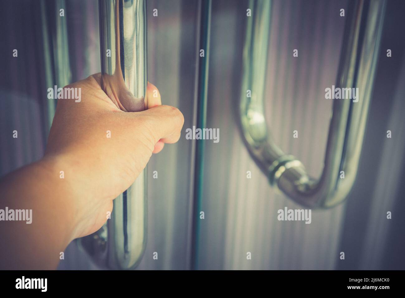 Man hand prepare to open the door to entering an Office background ...