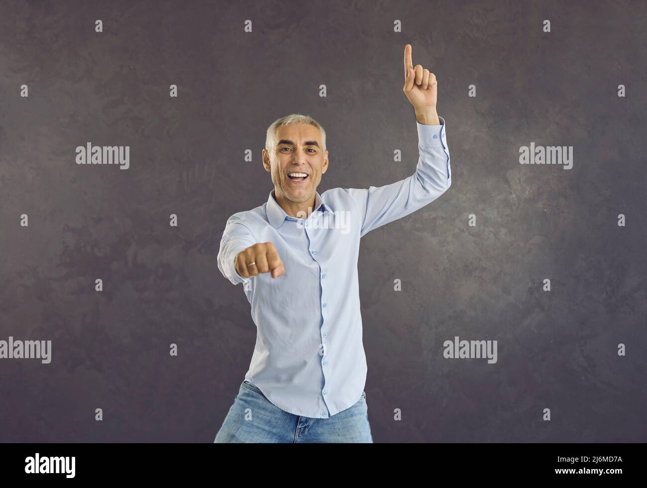 Portrait of happy cheerful senior man dancing gangnam style isolated on ...
