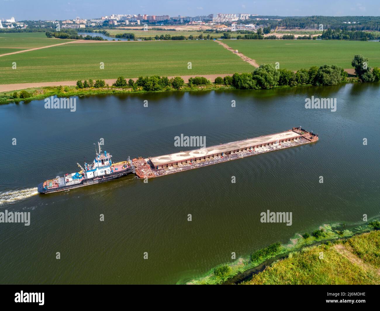A cargo barge floats on the river Stock Photo - Alamy