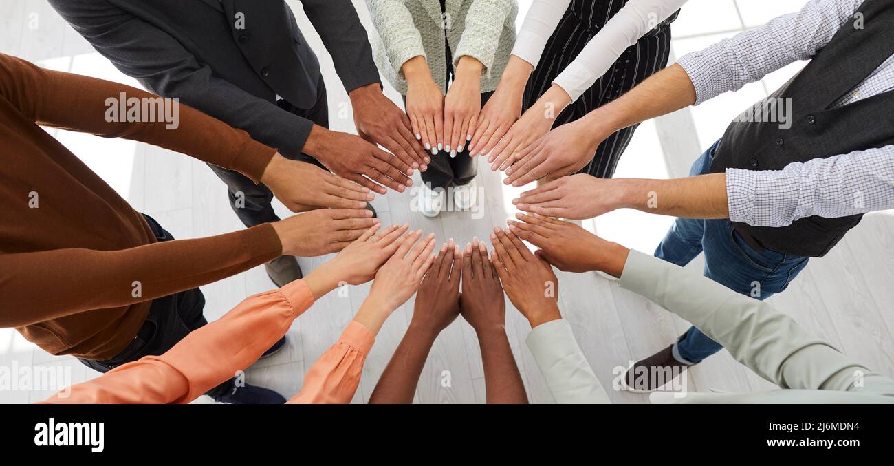 Multiracial diverse people join hands in circle Stock Photo - Alamy