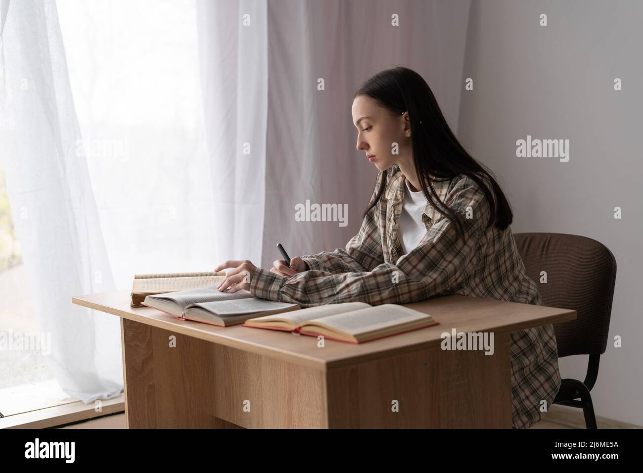 education and college concept, young asian student writing homework ...