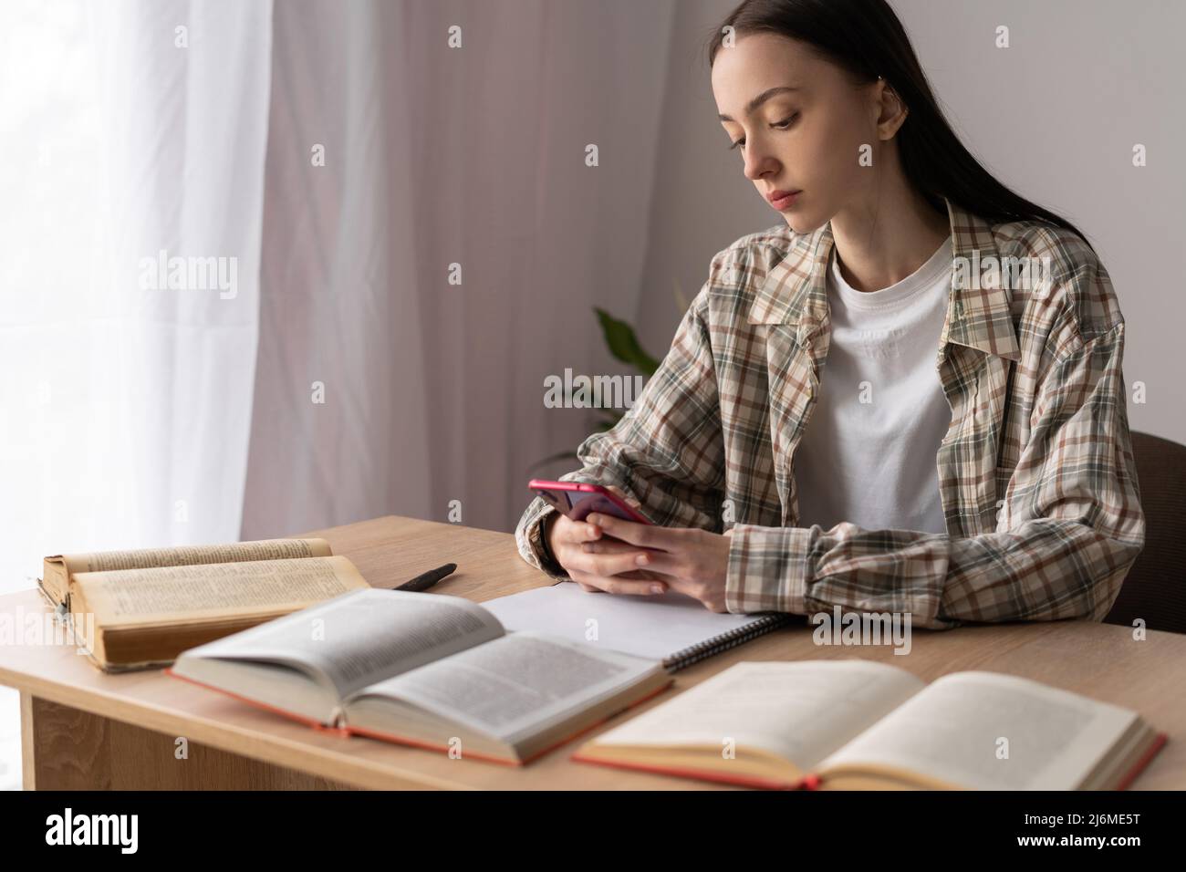 Caucasian young teenage girl distance learning using education apps ...