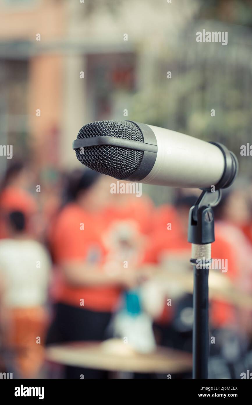 Close up of microphone in public place with blur background Stock Photo ...