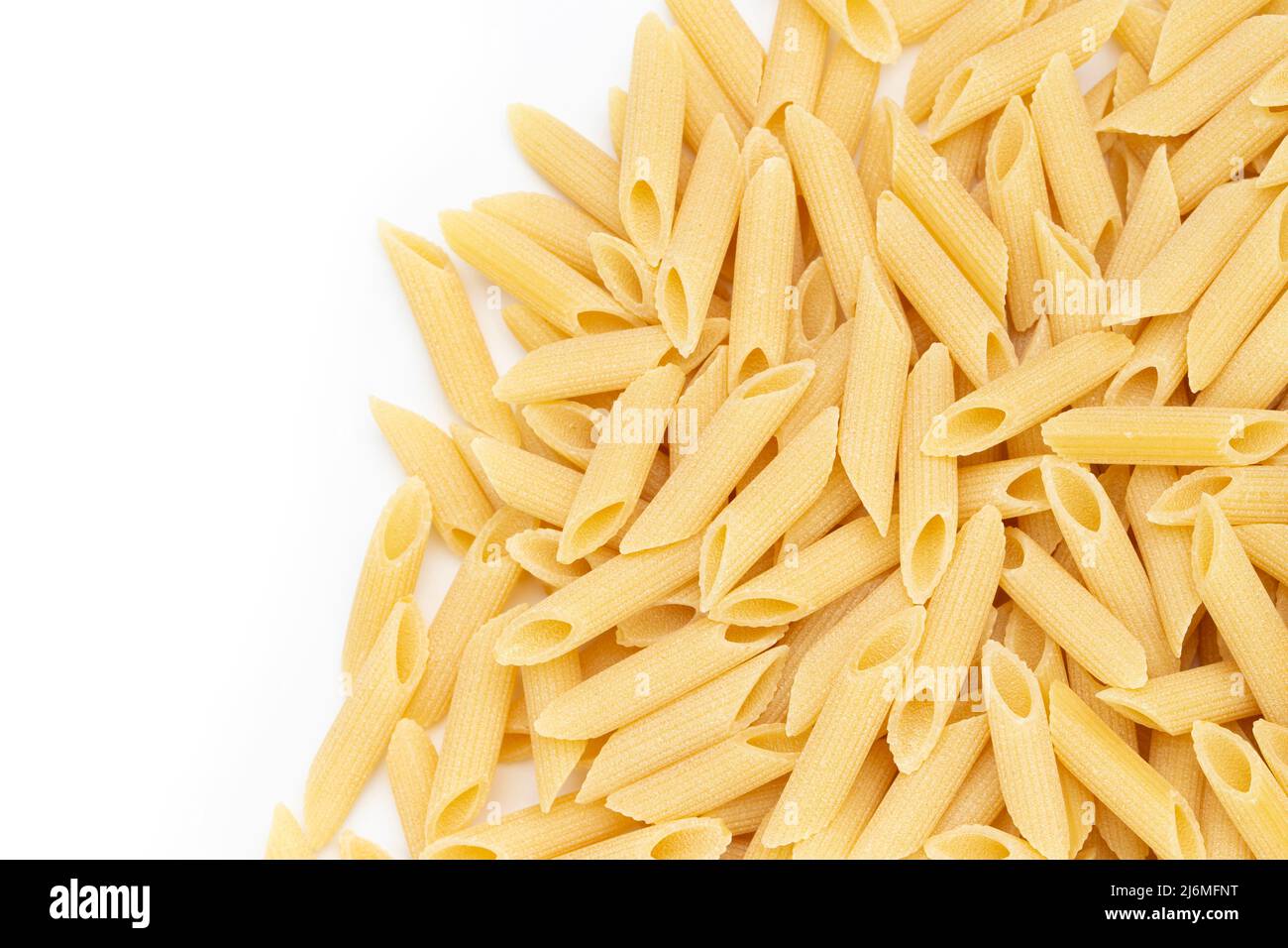 Pennette rigate. Raw pasta on white background. Space for text. Top ...
