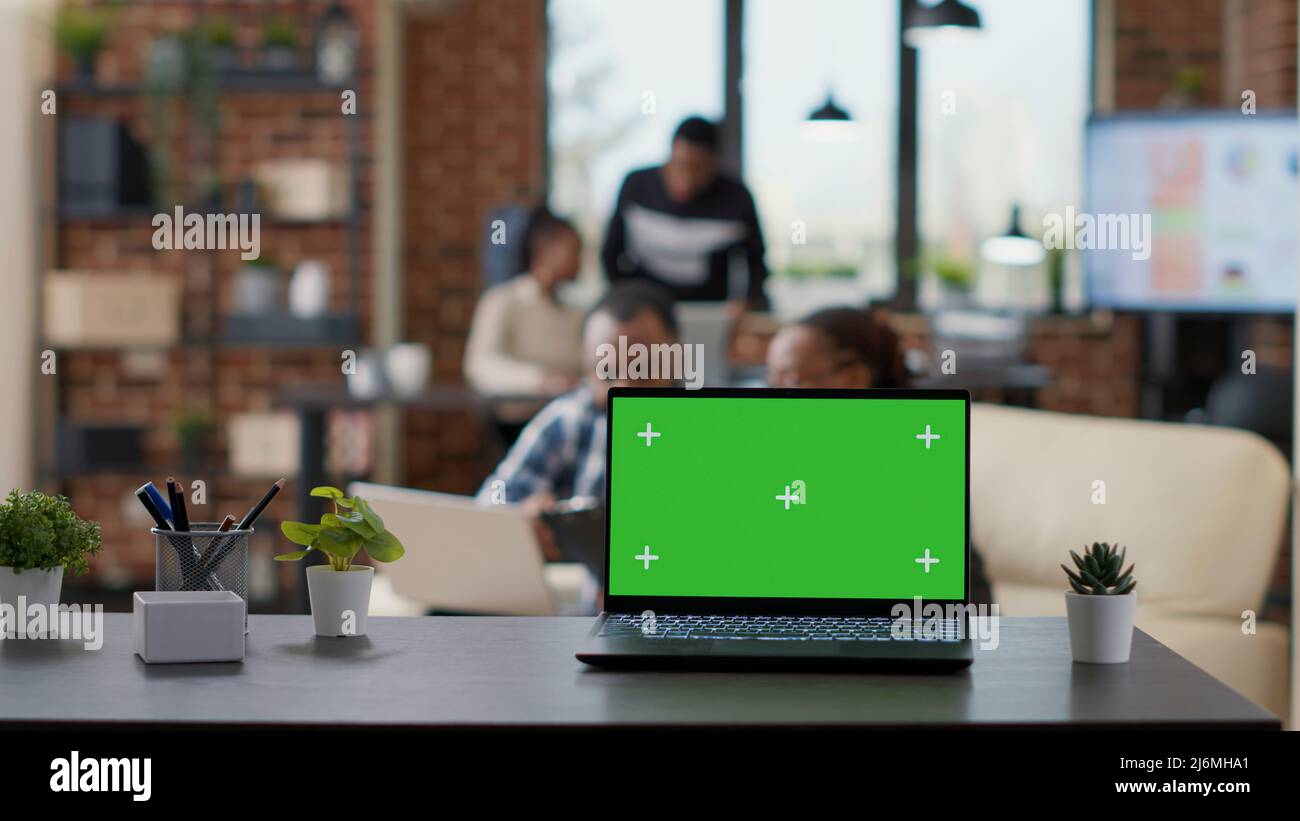 Businesspeople having green screen background on laptop, using office ...