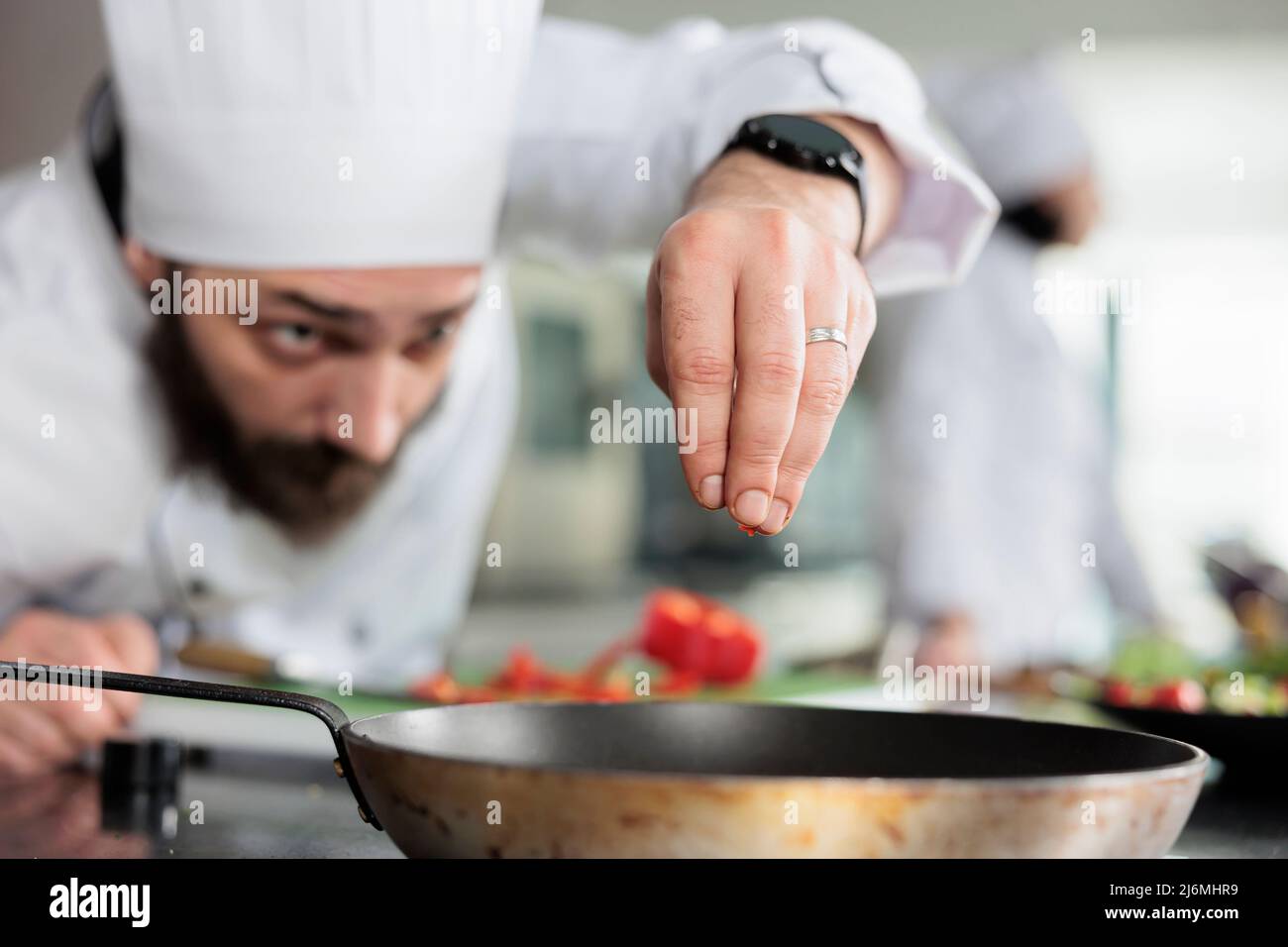 Gastronomy expert preparing dish with fresh and organic vegetables in ...