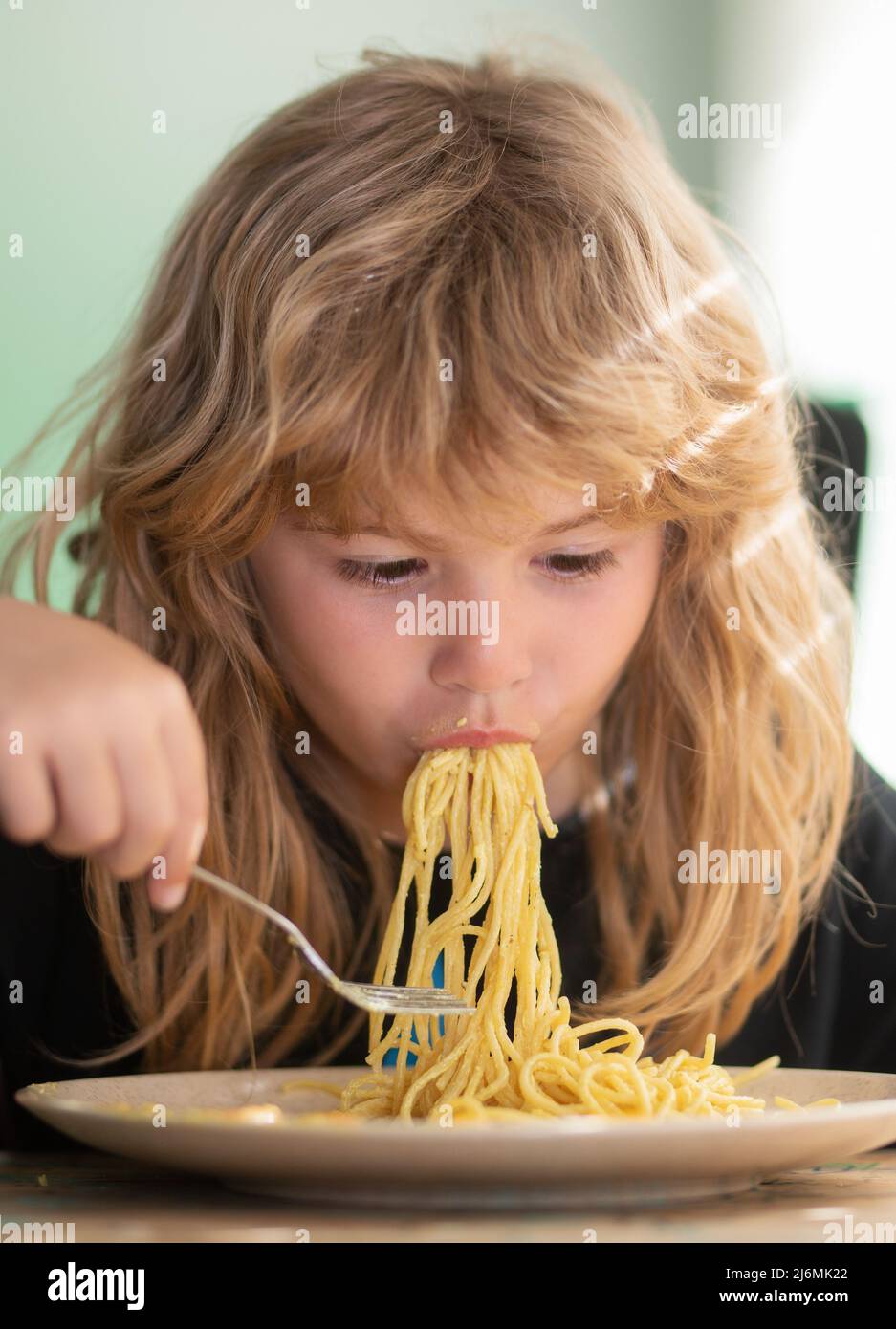 Child portrait eat spaghetti hungry hi-res stock photography and images ...
