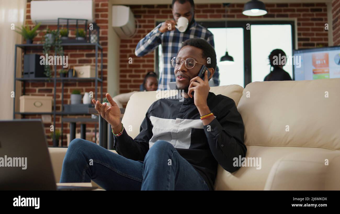 African american person chatting on phone call in business office ...