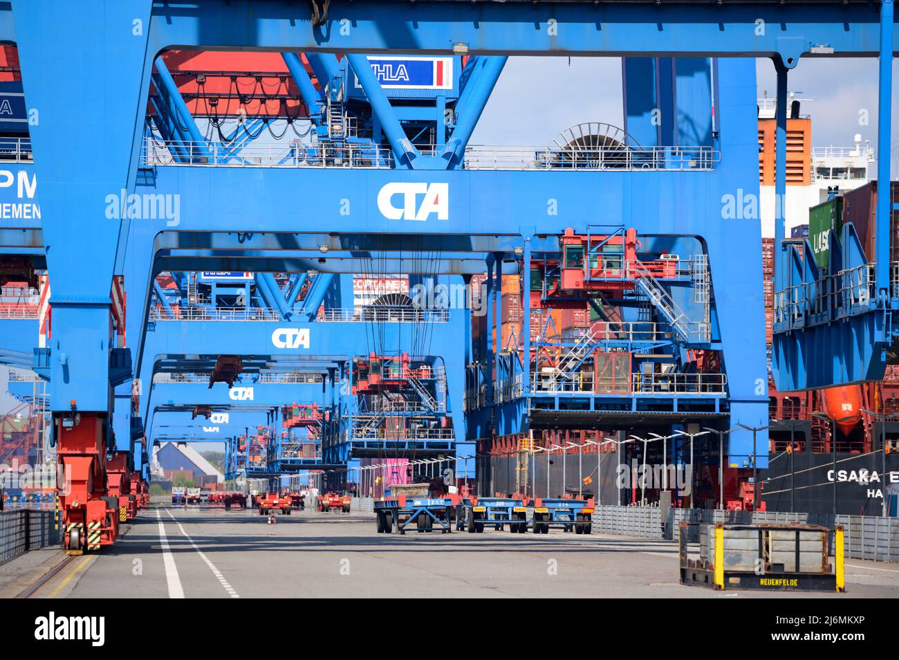 27 April 2022, Hamburg: Container gantry cranes on the site of HHLA ...