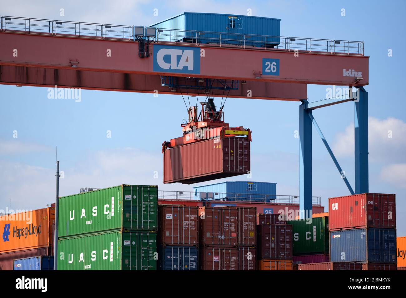 27 April 2022, Hamburg: A container is loaded on the premises of HHLA ...