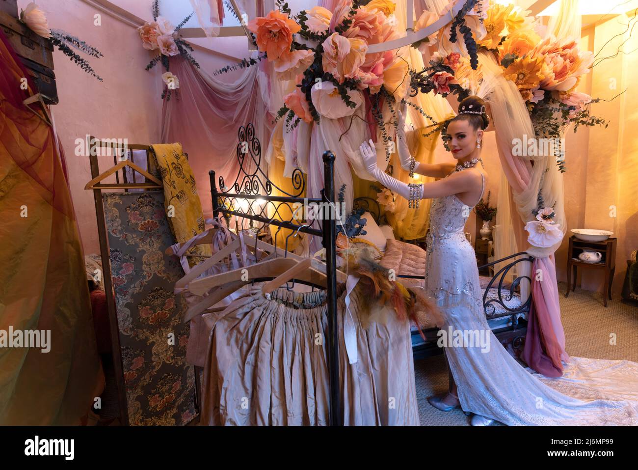 Dancer Claudine poses inside the Moulin Rouge windmill on May 2, 2022 ...
